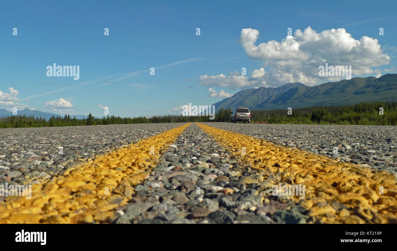 Yellow lines on highway ground view Stock Photo - Alamy