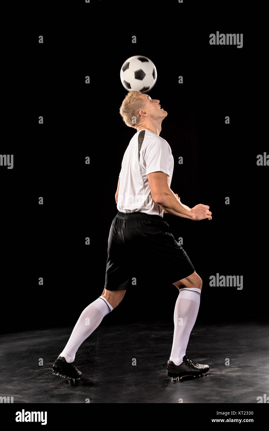 Soccer player with ball Stock Photo - Alamy