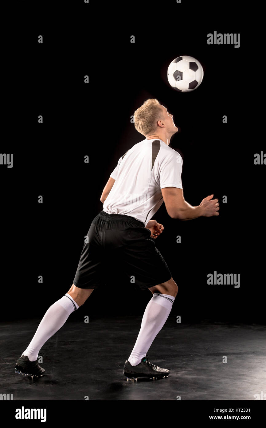 Soccer player with ball Stock Photo - Alamy