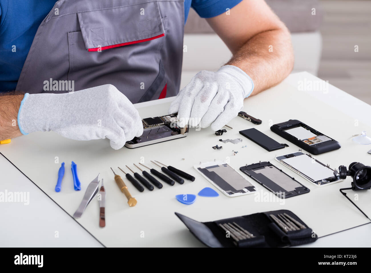 Person's Hand Repairing Cellphone Stock Photo - Alamy
