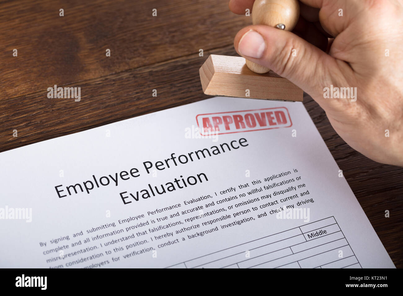 An Approved Stamp On Performance Evaluation Form Stock Photo - Alamy