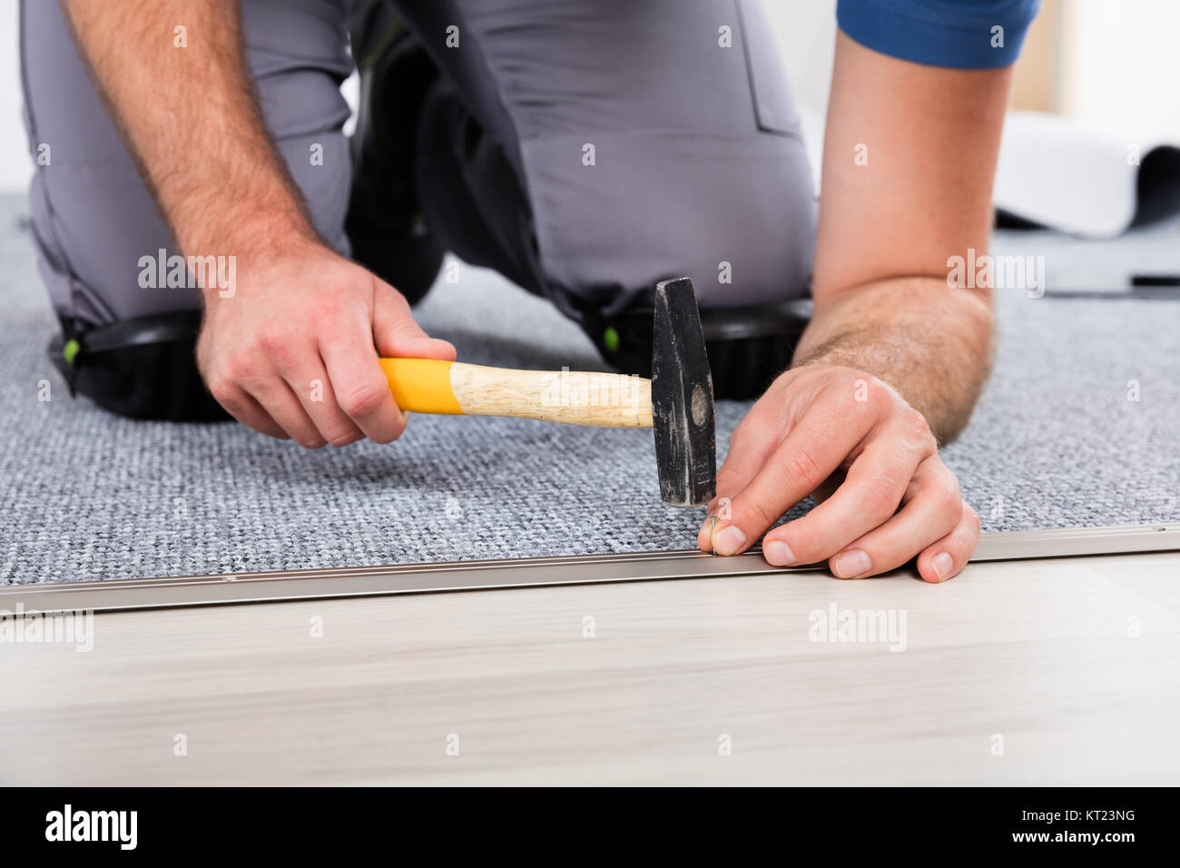 Hand holding hammer nail hi-res stock photography and images - Alamy