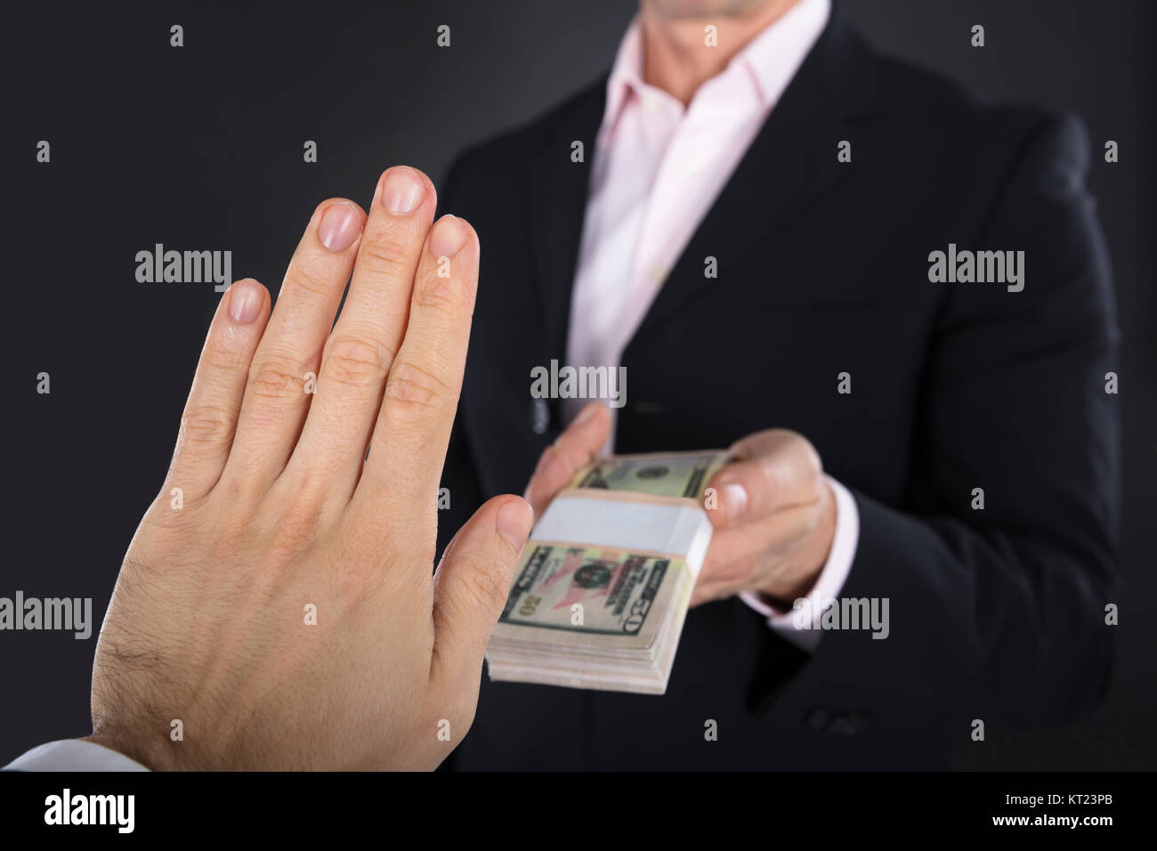 Close-up Of A Businessman Hand Refusing Bribe Stock Photo - Alamy
