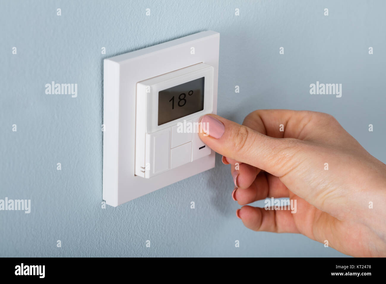 Person Setting The Thermostat Stock Photo - Alamy
