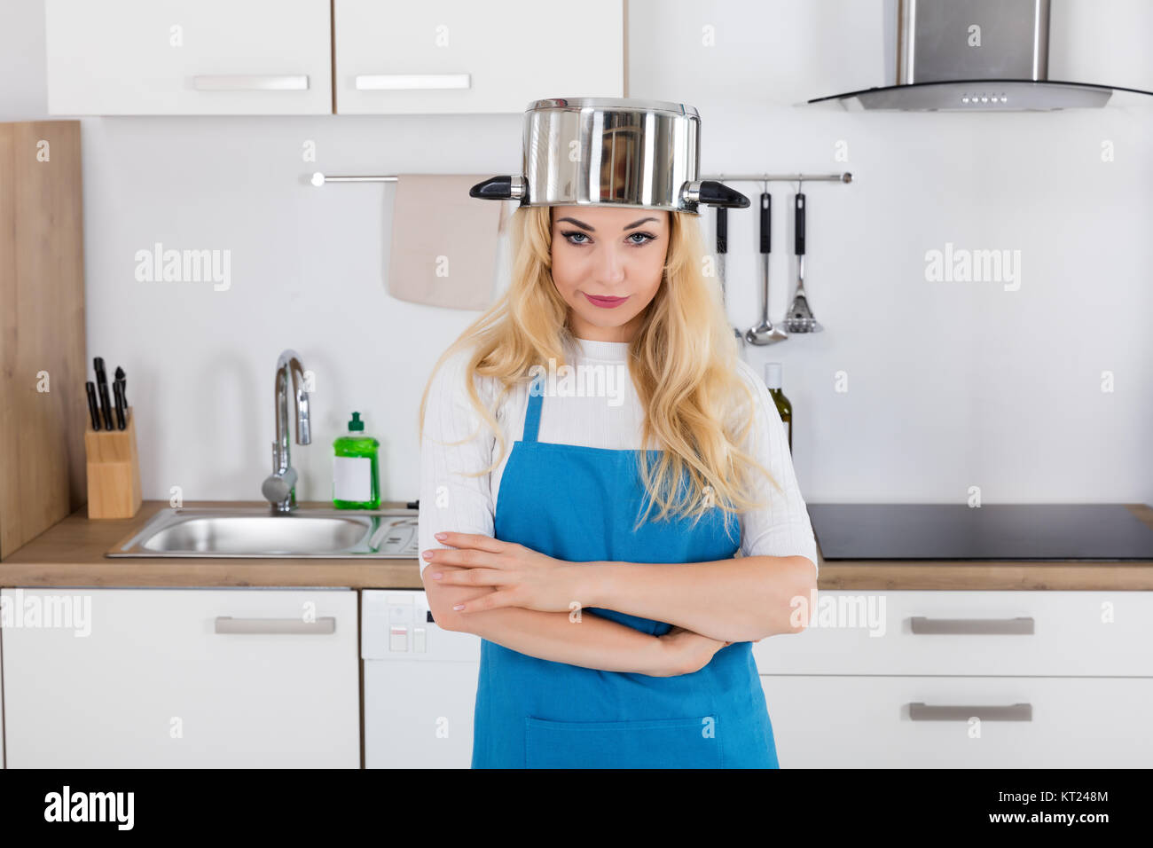 Woman With Cooking Pan On Head Stock Photo - Alamy