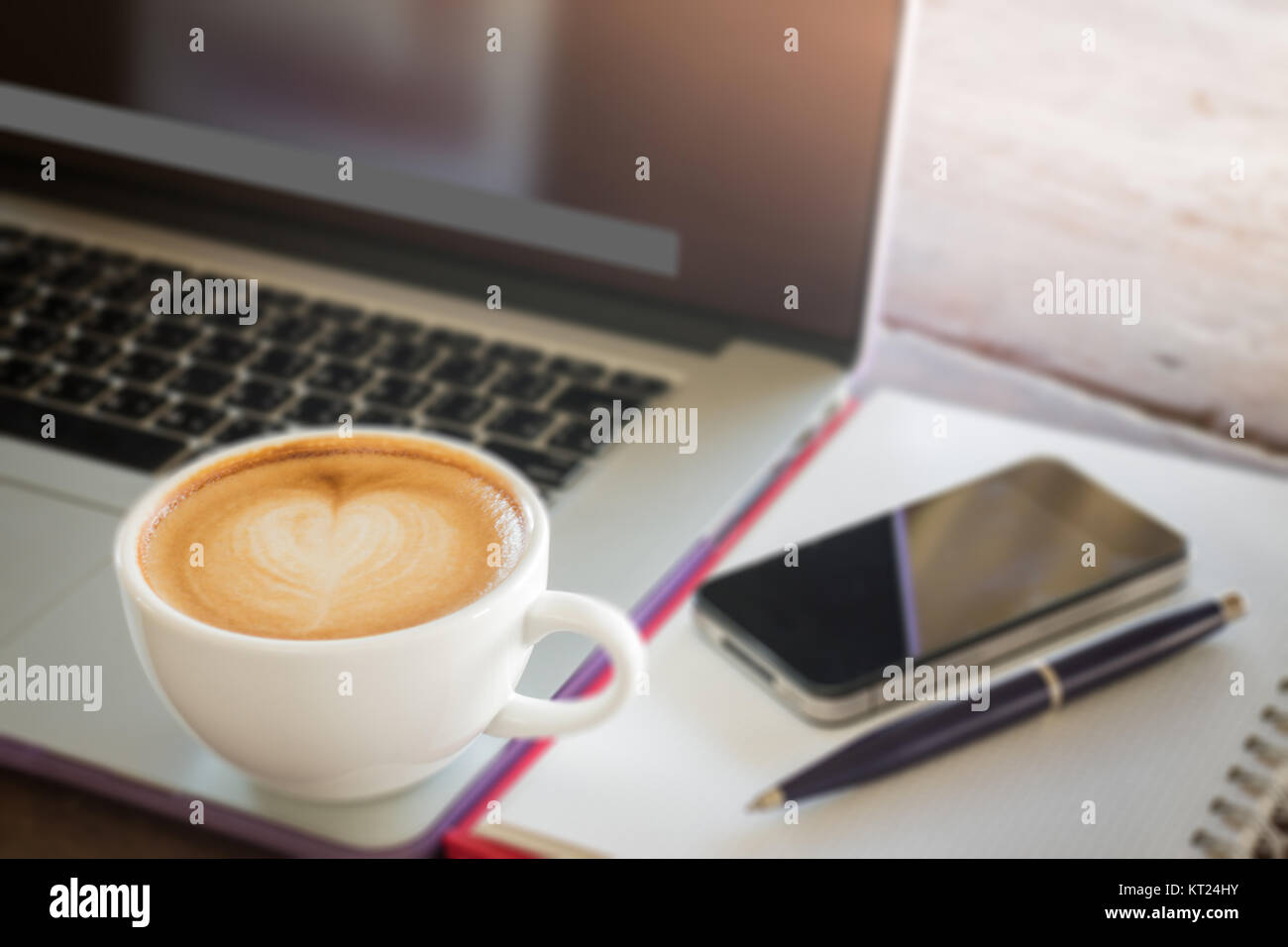 Coffee latte on work table Stock Photo - Alamy