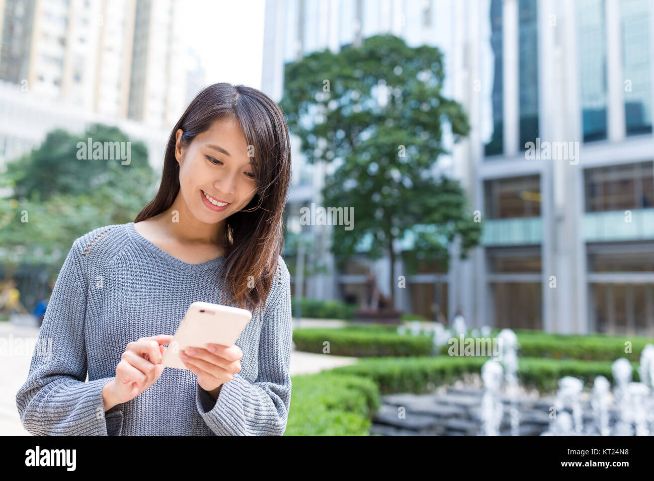 Woman text message on mobile phone Stock Photo - Alamy