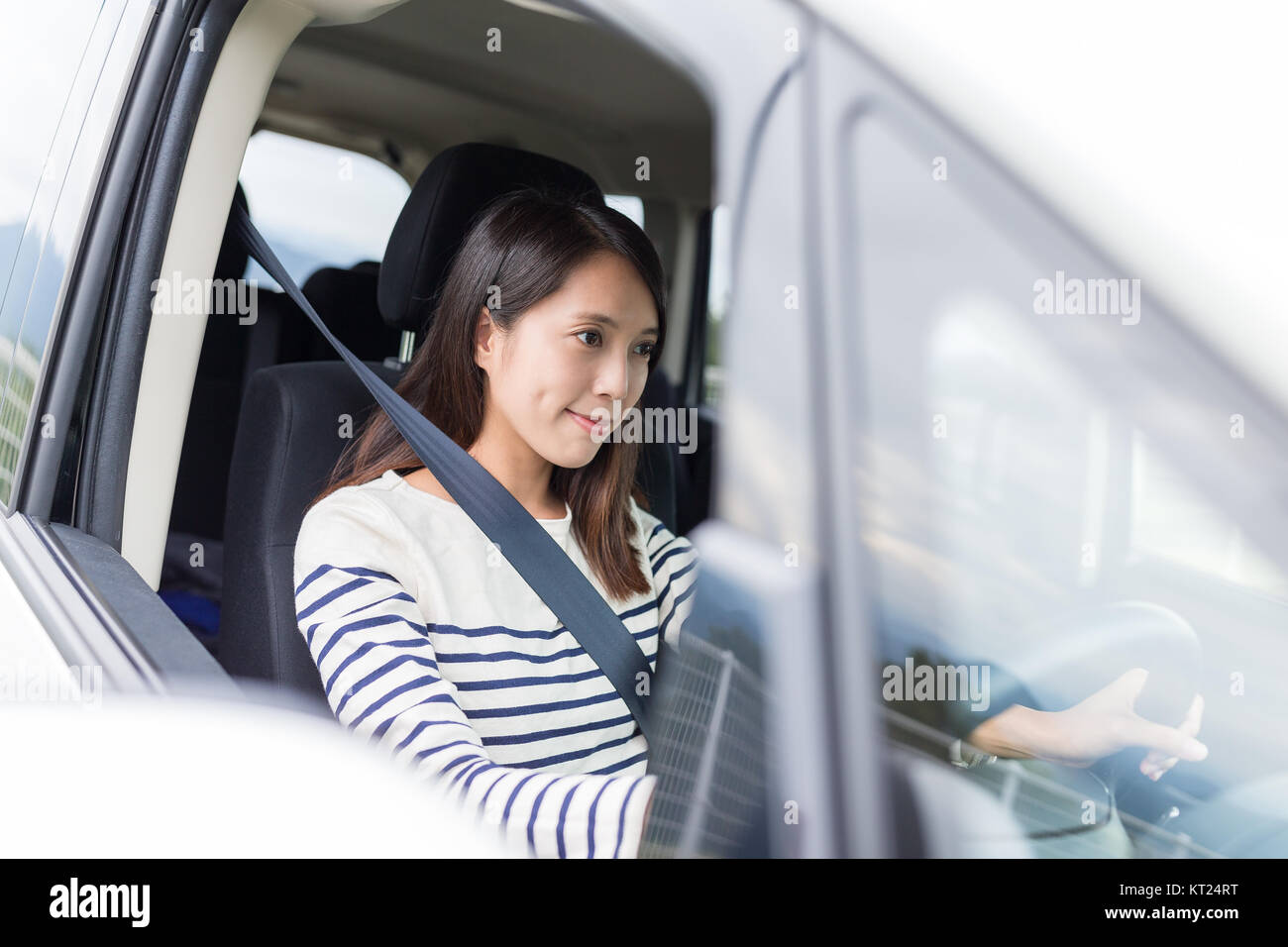 Asian Woman driving a car Stock Photo - Alamy