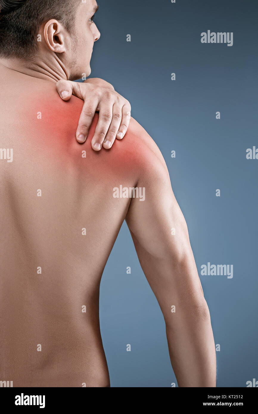 Man with pain in shoulder Stock Photo - Alamy