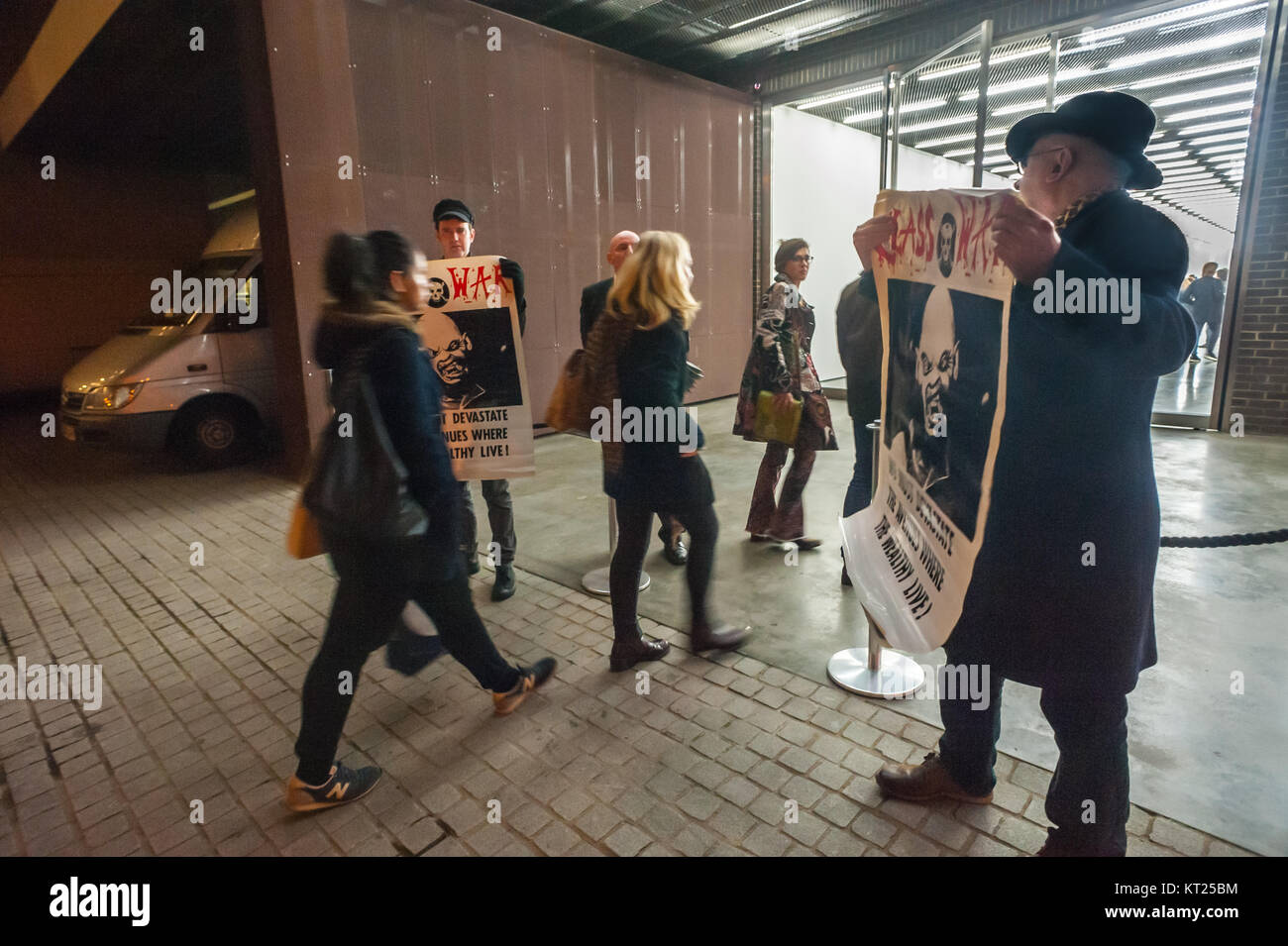 Simon Elmer & Ian Bone stand holding Class War posters at the entrance ...