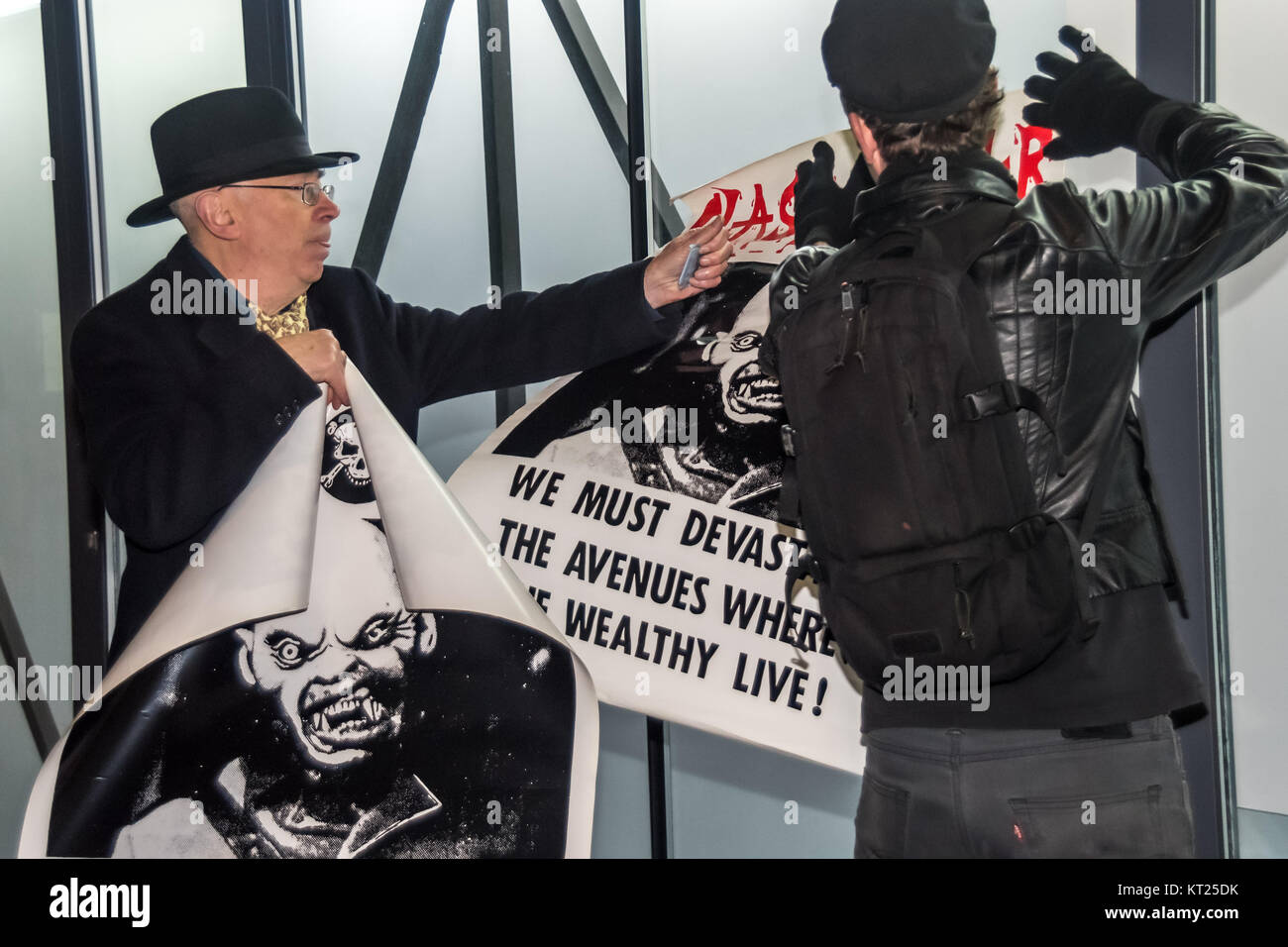 Ian Bone and Simon Elmer put up Class War's posters with Blutak on the ...