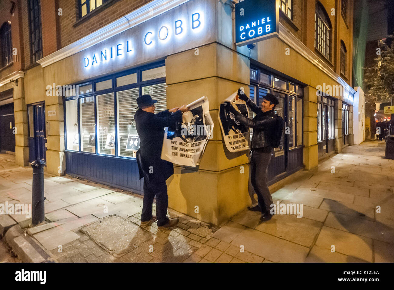 Ian Bone and Simon Elmer display the Class War posters 'We must ...