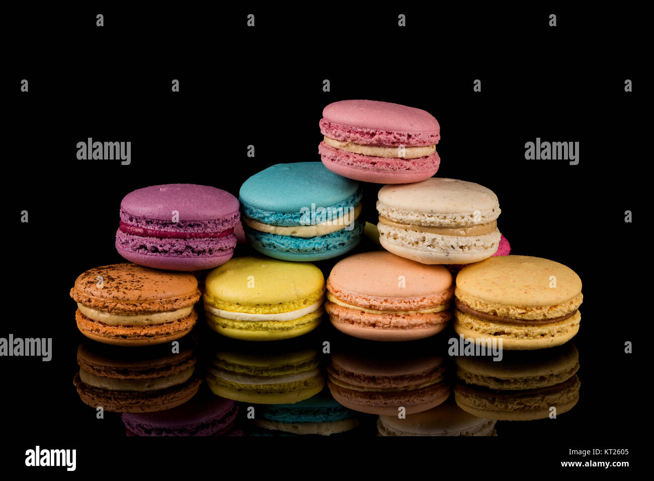 Colorful macaroon over black background Stock Photo - Alamy