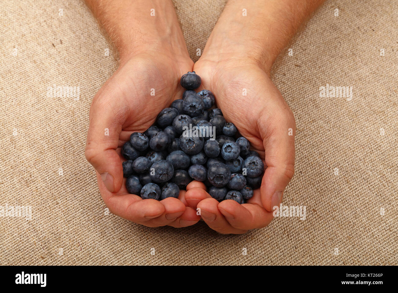 Man hands with heart shaped blueberries Stock Photo - Alamy