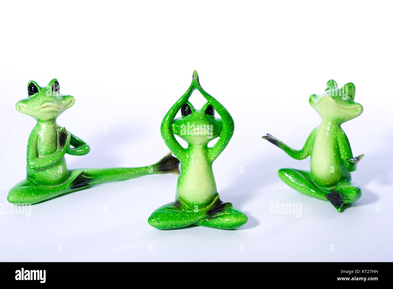 Group of green frog figures stretching and doing yoga exercises Stock ...