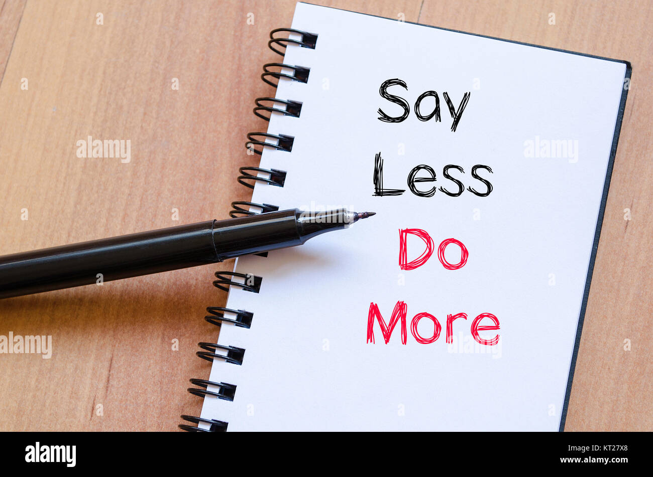 Say less do more concept on notebook Stock Photo - Alamy