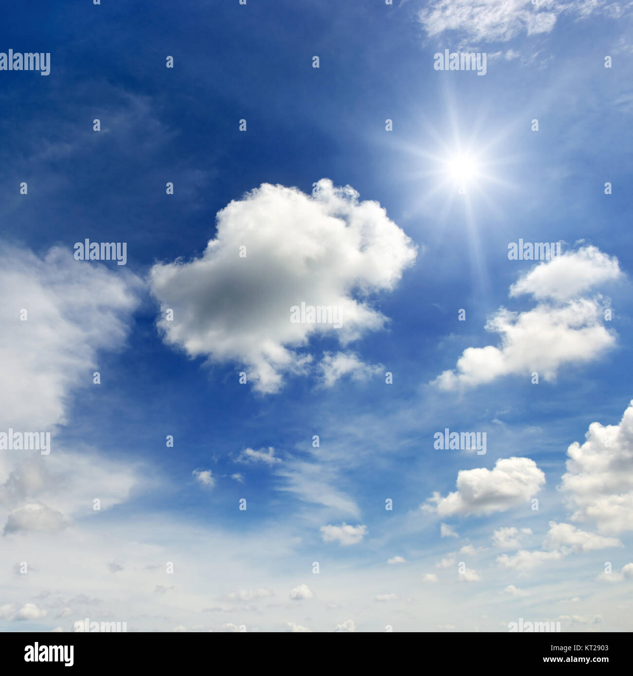 Bright sun and clouds on the background of an epic dark blue sky Stock ...