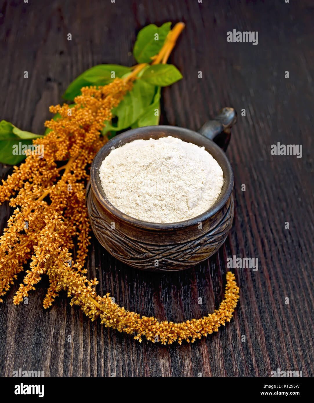 Flour amaranth in clay cup on board Stock Photo - Alamy