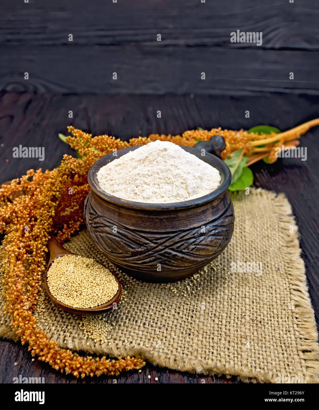 Flour amaranth in clay cup with flower on dark board Stock Photo - Alamy