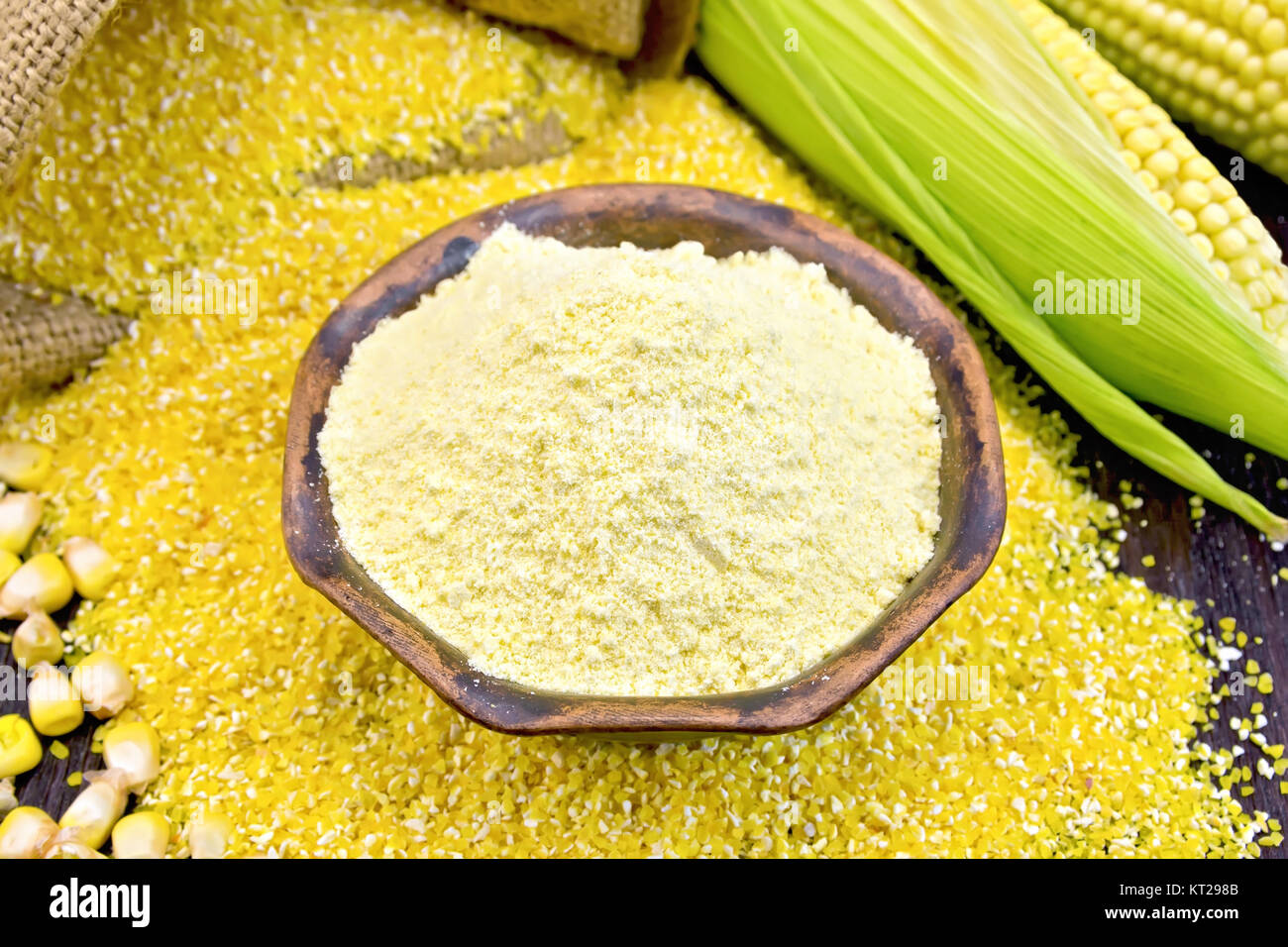 Flour corn in bowl with grains on board Stock Photo - Alamy