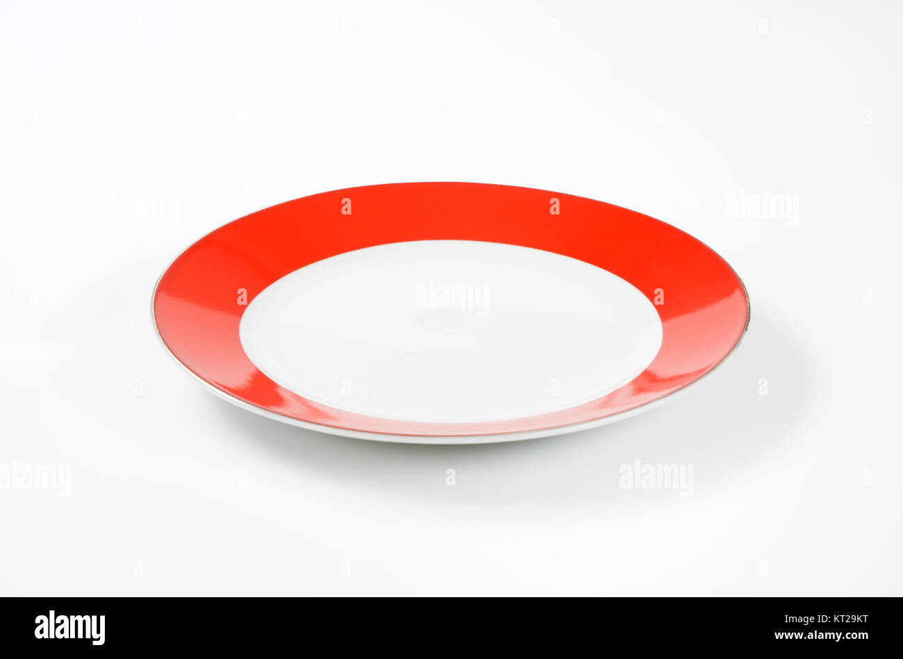 White plate with red rim Stock Photo - Alamy
