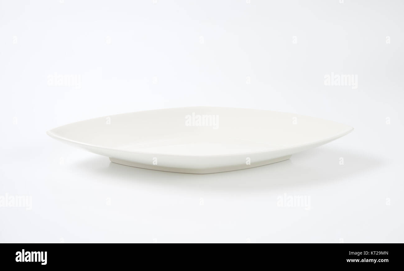 diamond shaped white dinner plate Stock Photo - Alamy