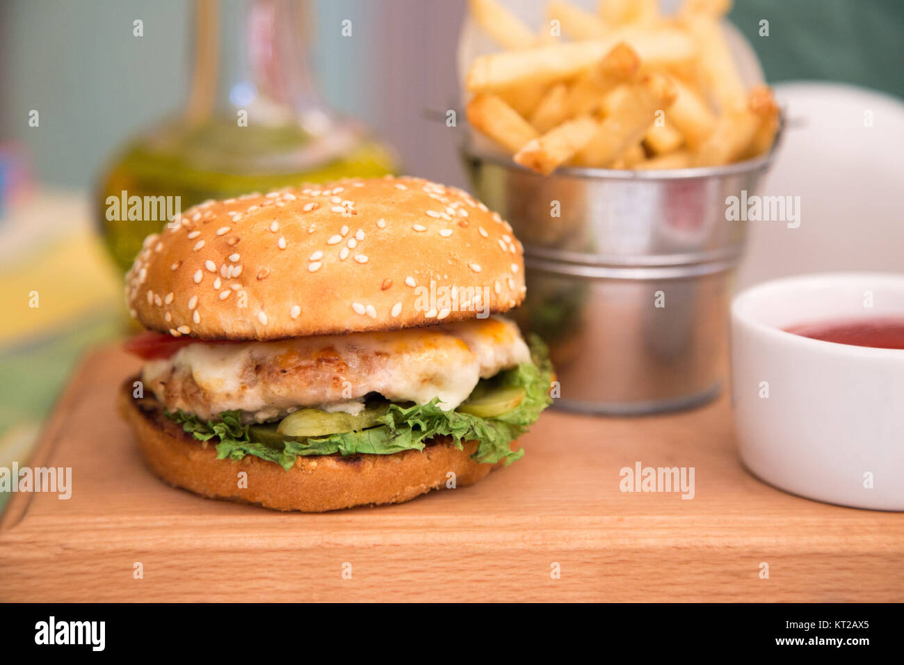Burger with chicken cutlet and fries Stock Photo - Alamy