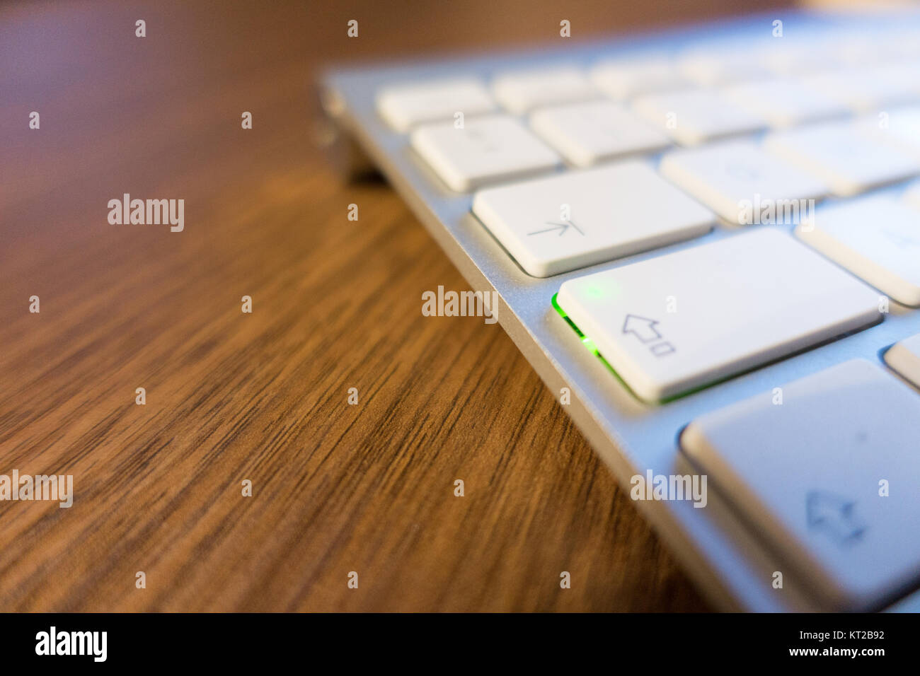 White and Grey Keyboard on Wooden Table Stock Photo - Alamy