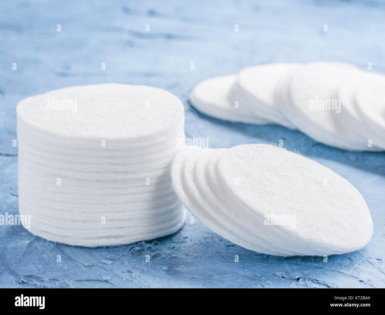 cotton pads on blue concrete background Stock Photo - Alamy