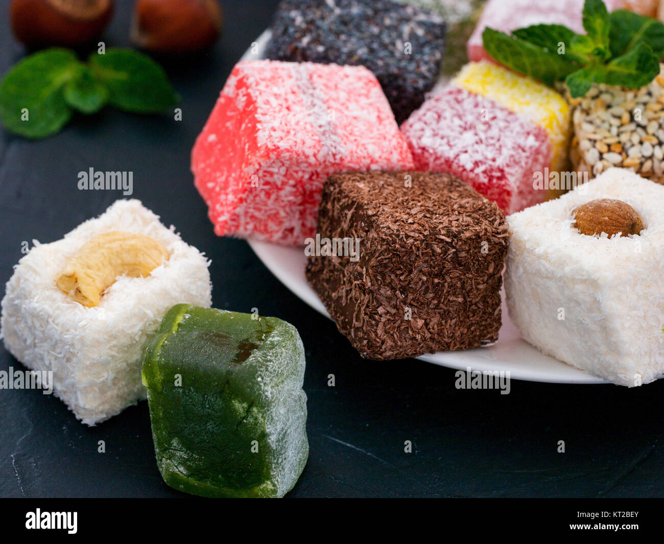 Turkish delight on black rustic background Stock Photo - Alamy