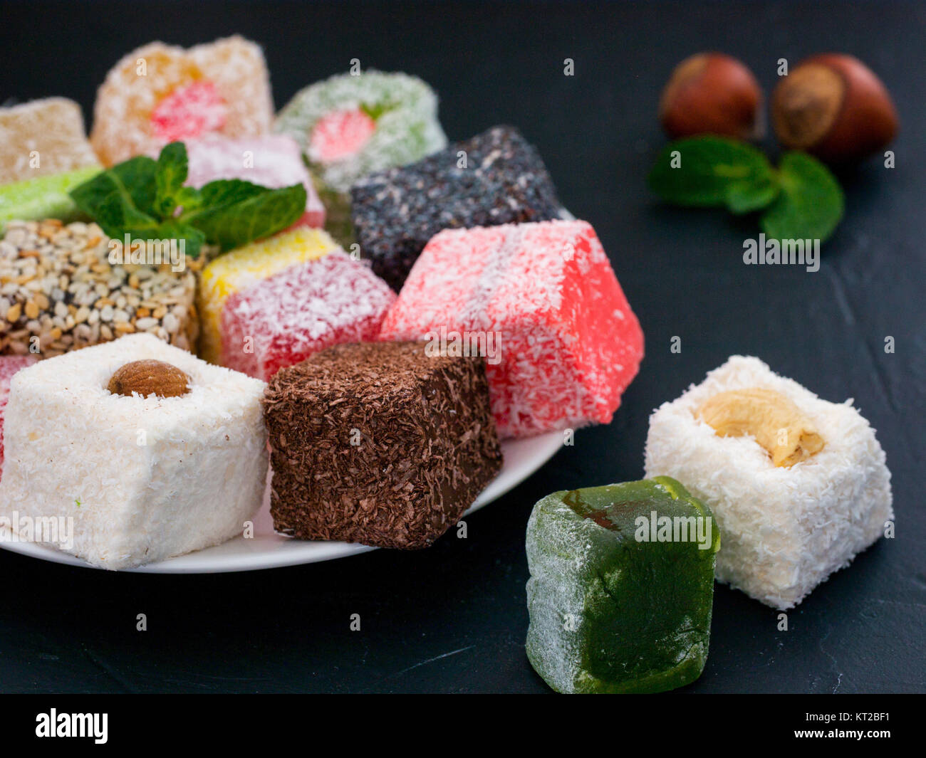 Turkish delight on black rustic background Stock Photo - Alamy