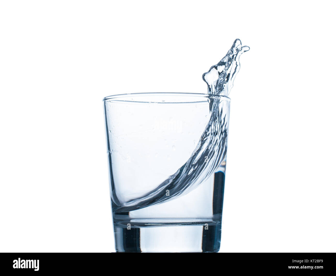 water splashing from glass isolated on white background Stock Photo - Alamy
