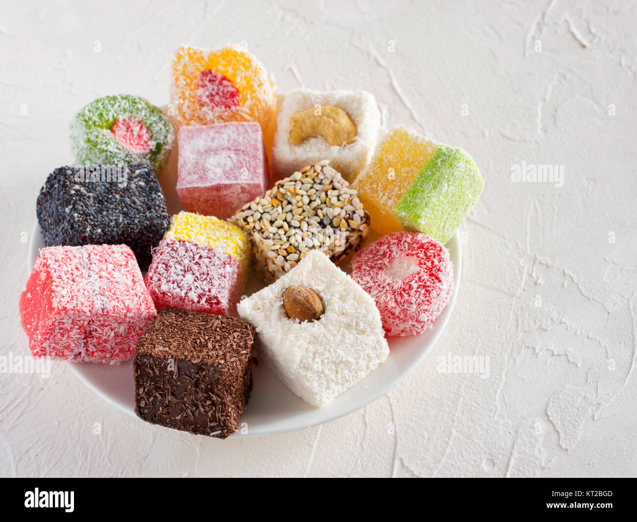Turkish delight on white rustic background Stock Photo - Alamy