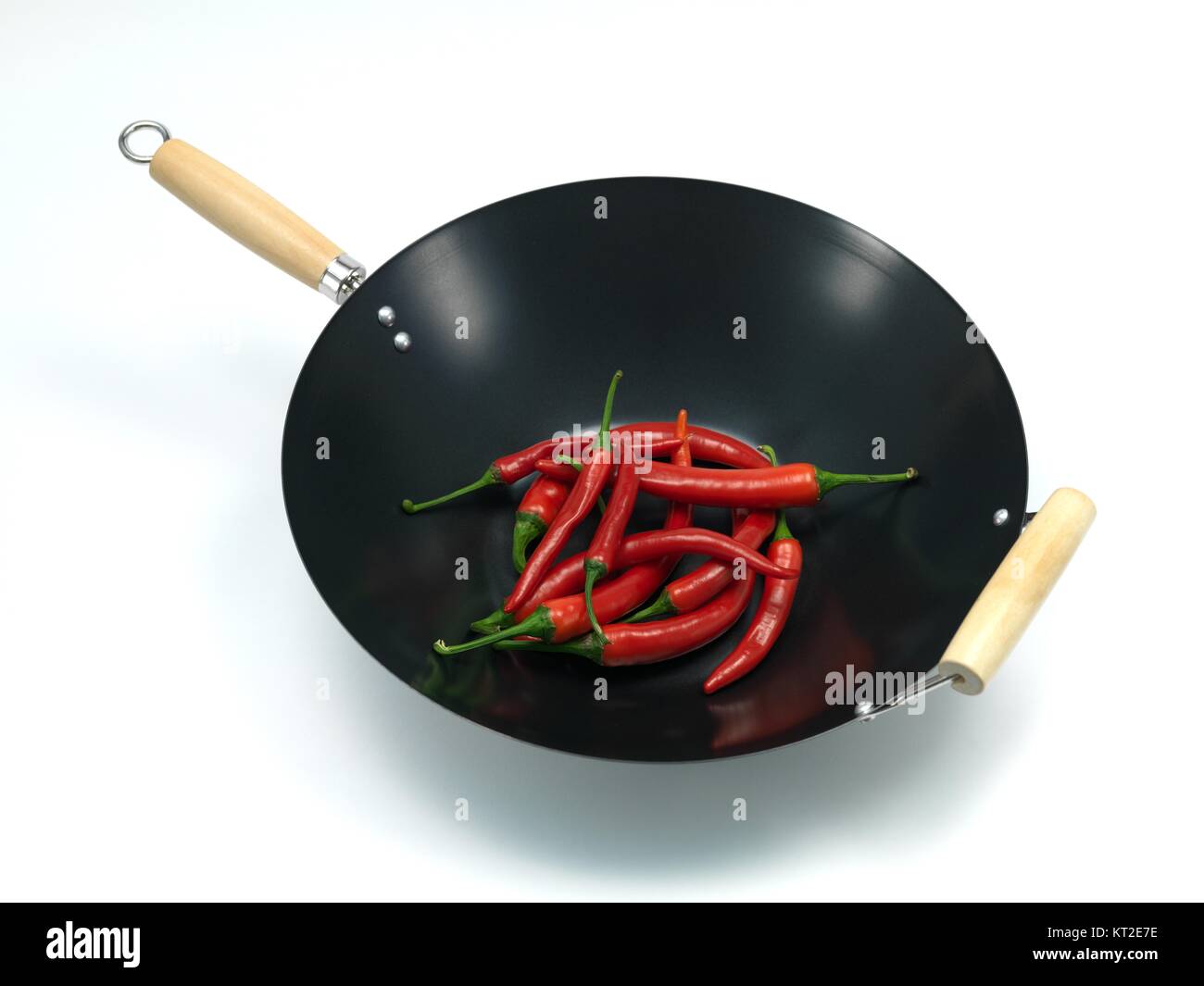 A wok isolated against a white background Stock Photo - Alamy