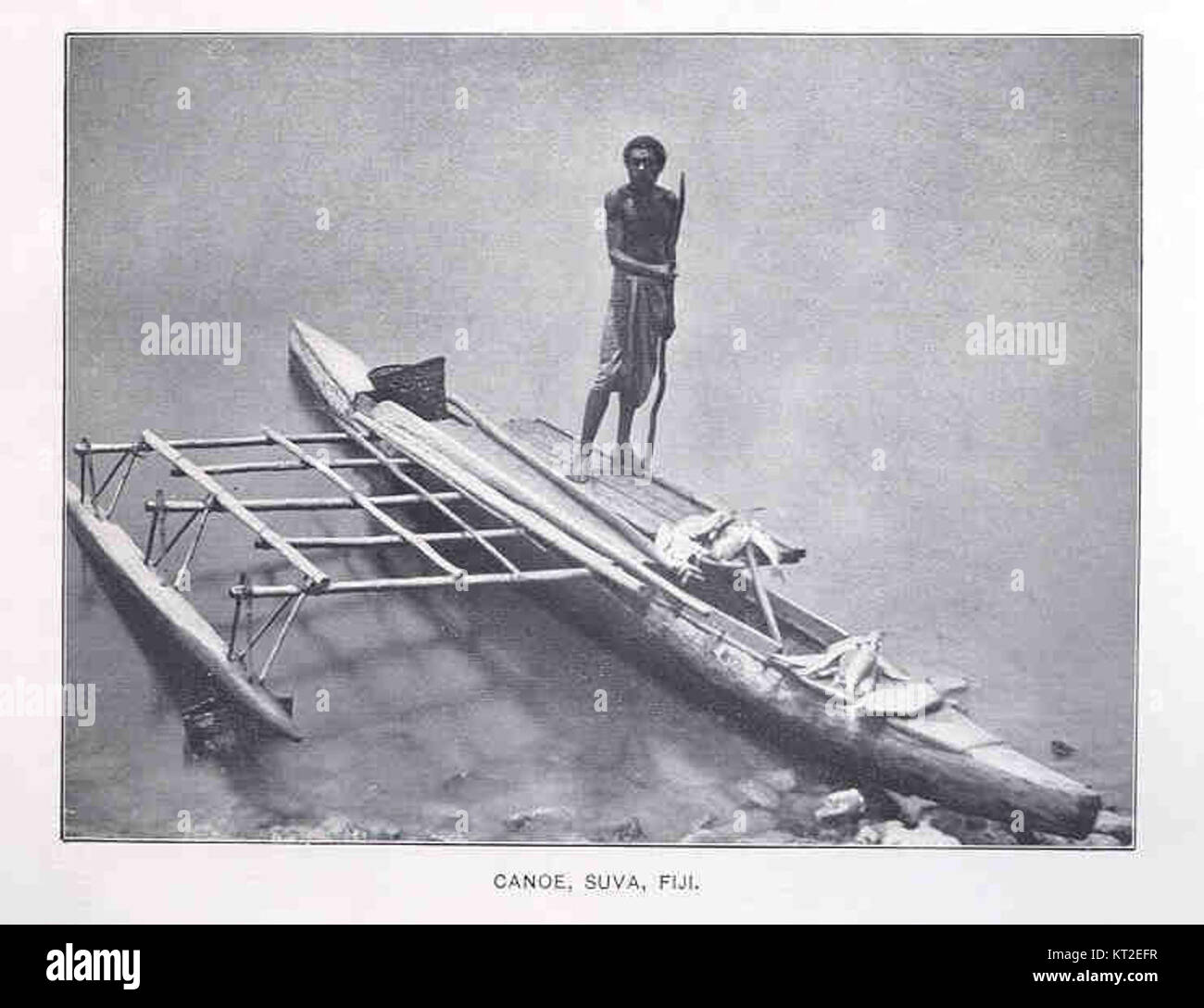 This image features a canoe in Suva, Fiji, showcasing a traditional ...