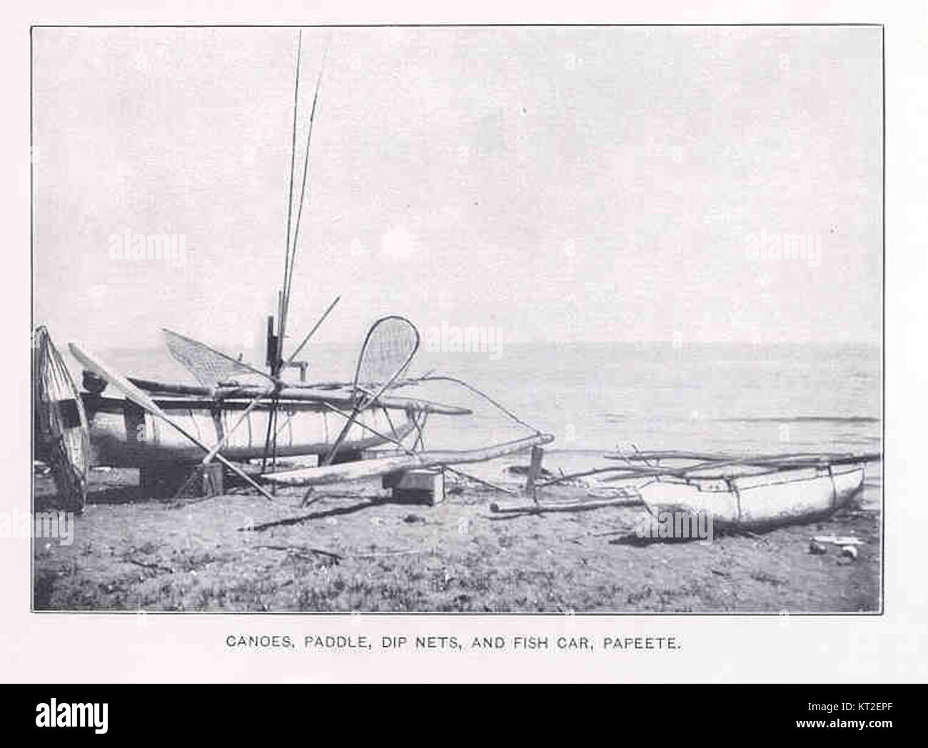 A historical photograph capturing traditional canoe use, paddle dip ...