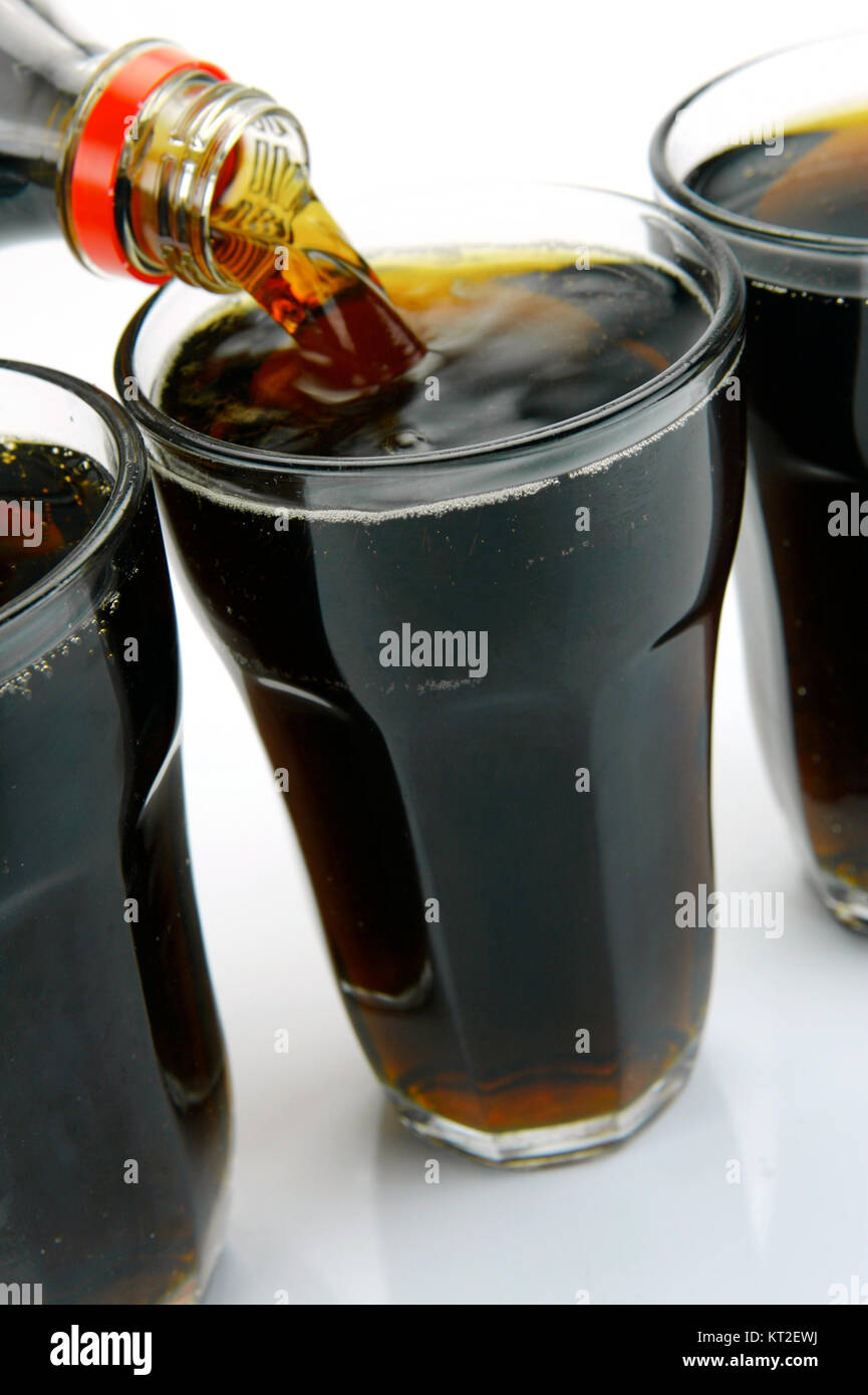 Glasses of cola isolated against a white background Stock Photo - Alamy