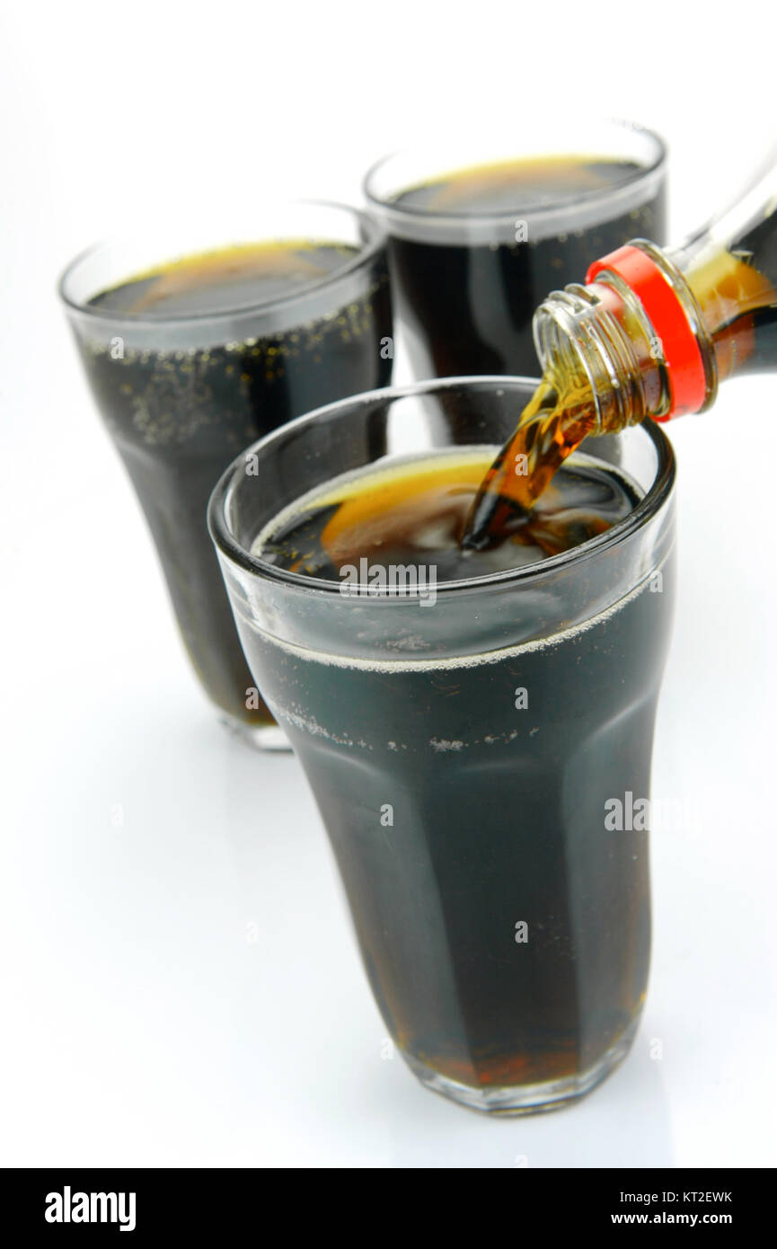 Glasses of cola isolated against a white background Stock Photo - Alamy