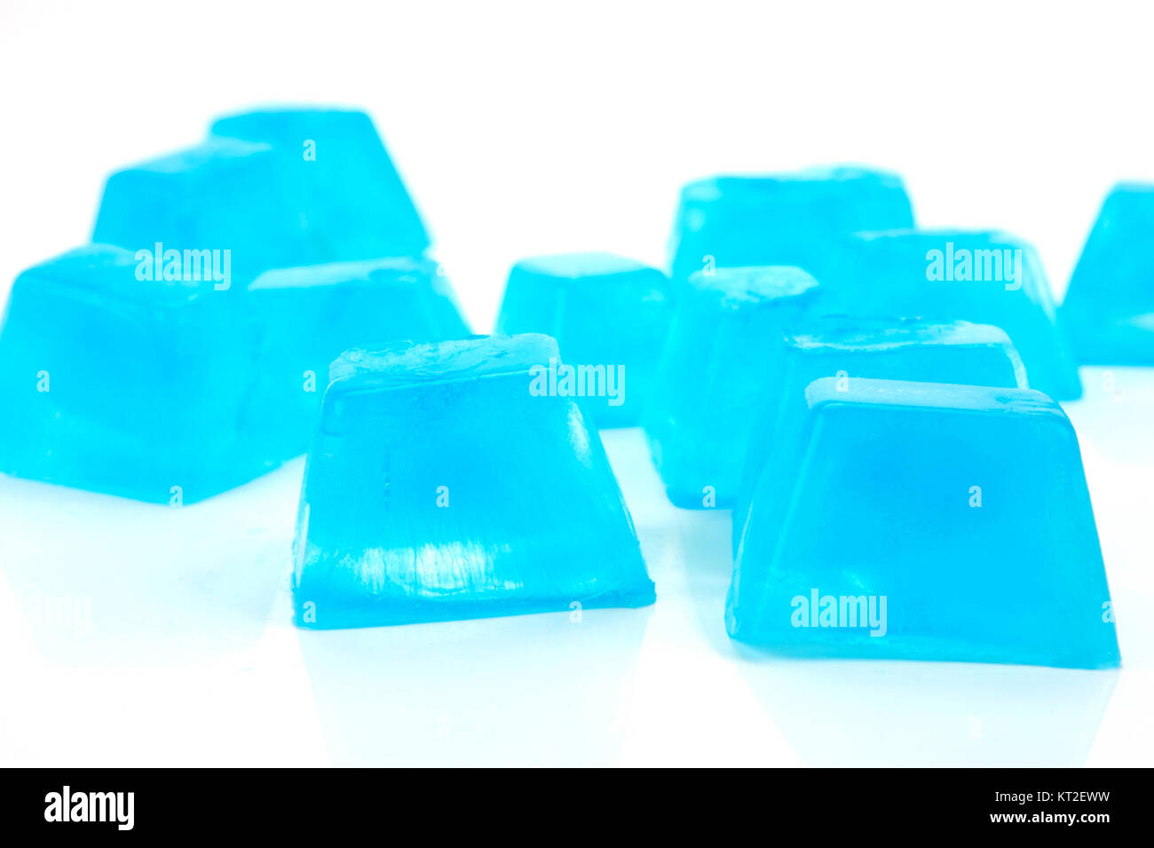 Blue ice blocks isolated against a white background Stock Photo - Alamy