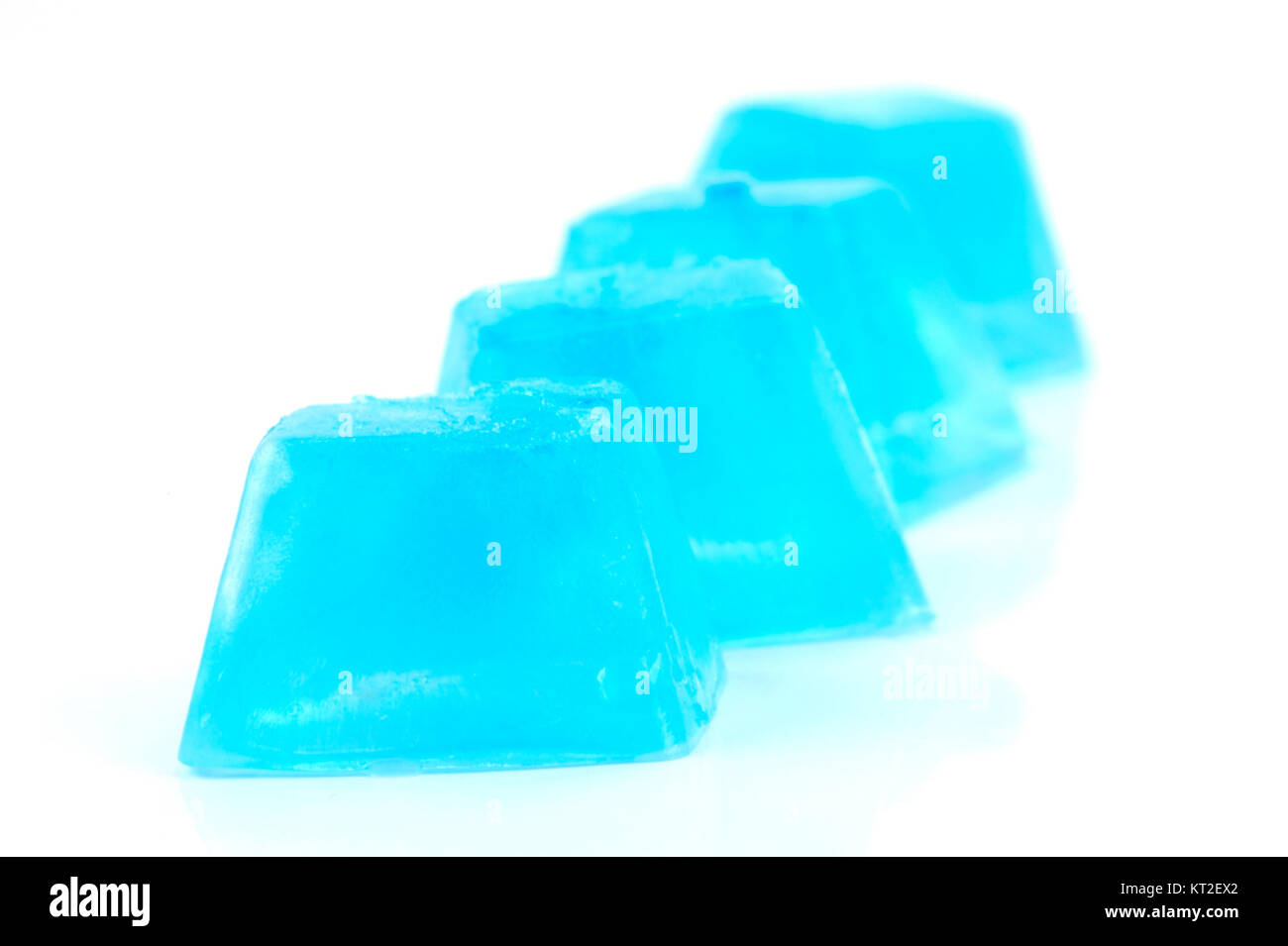 Blue ice blocks isolated against a white background Stock Photo - Alamy