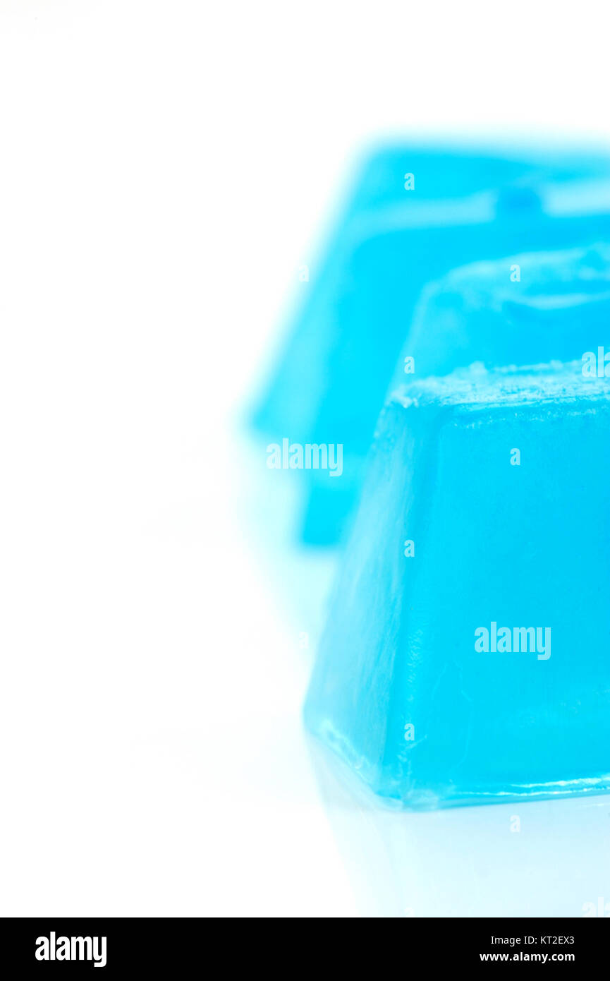Blue ice blocks isolated against a white background Stock Photo - Alamy