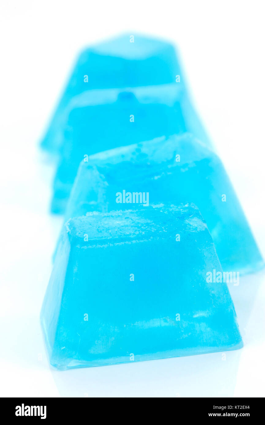 Blue ice blocks isolated against a white background Stock Photo - Alamy