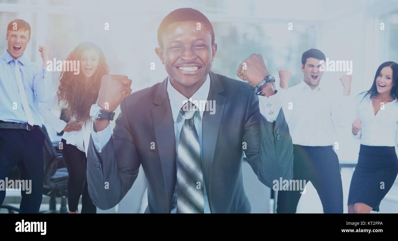 Business team celebrating a triumph with arms up Stock Photo - Alamy