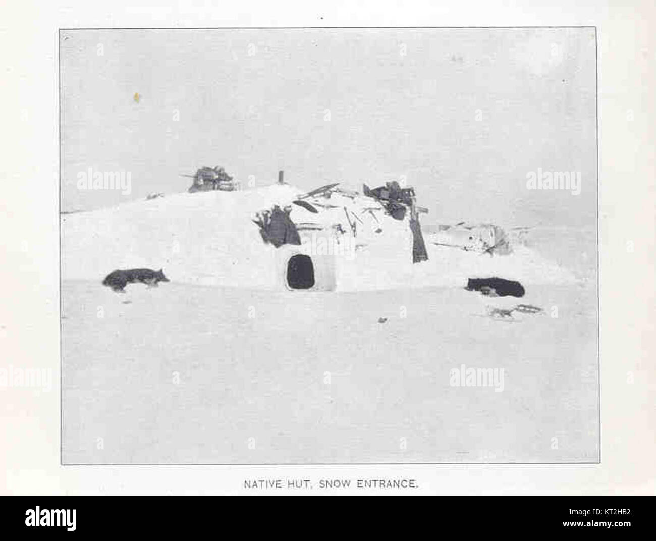 A native hut entrance covered in snow, reflecting traditional ...