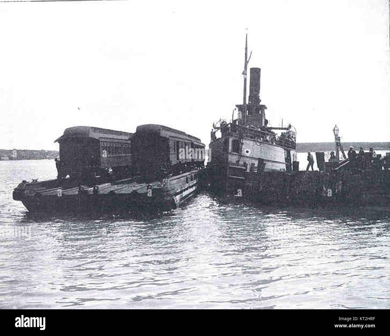 This image depicts an old transfer operation at the Strait of Canso, a ...