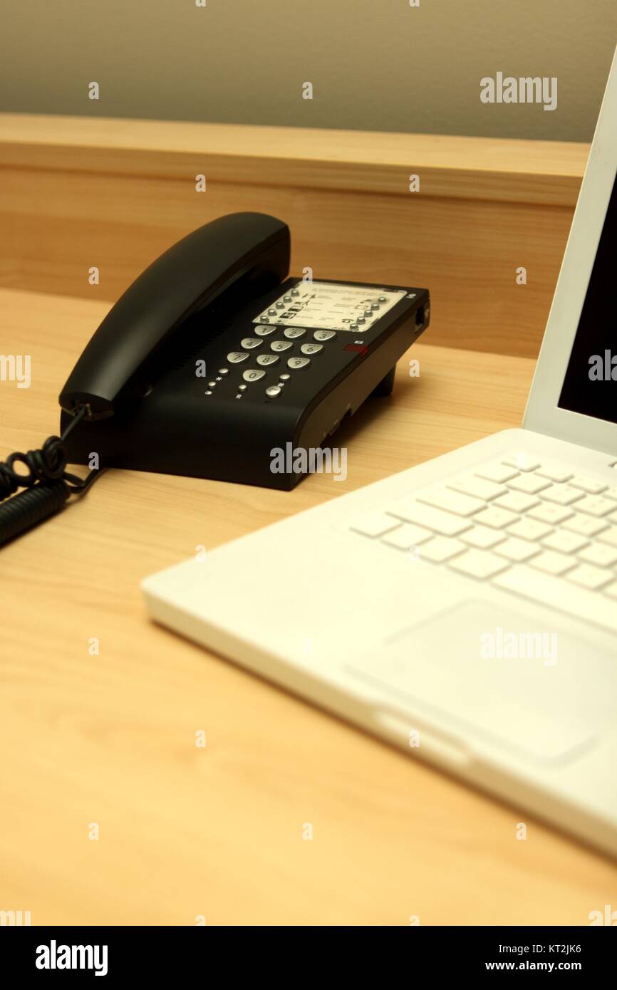 An office desk with office items in a work place scene Stock Photo - Alamy
