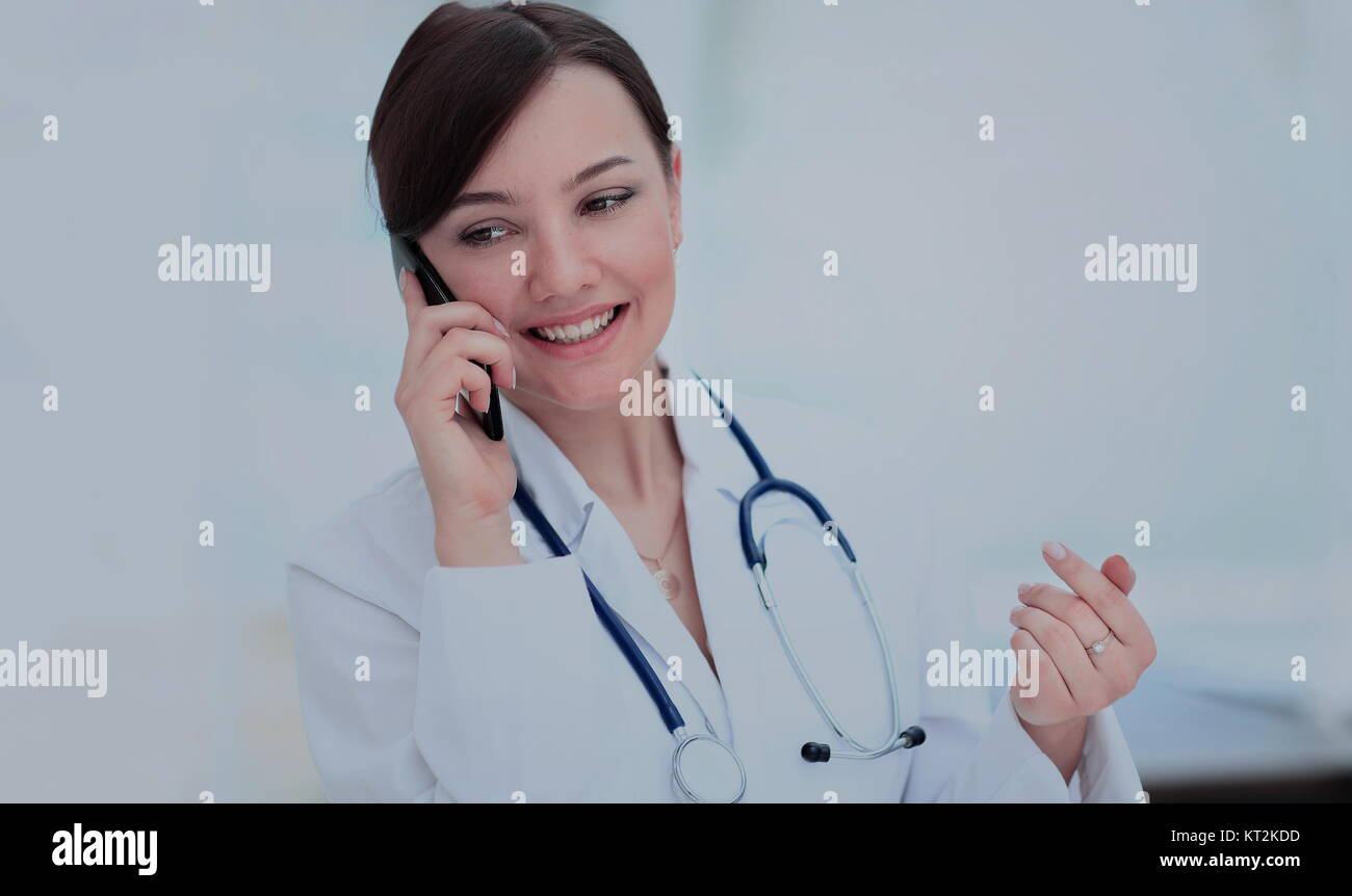 Doctor talking on telephone Stock Photo - Alamy