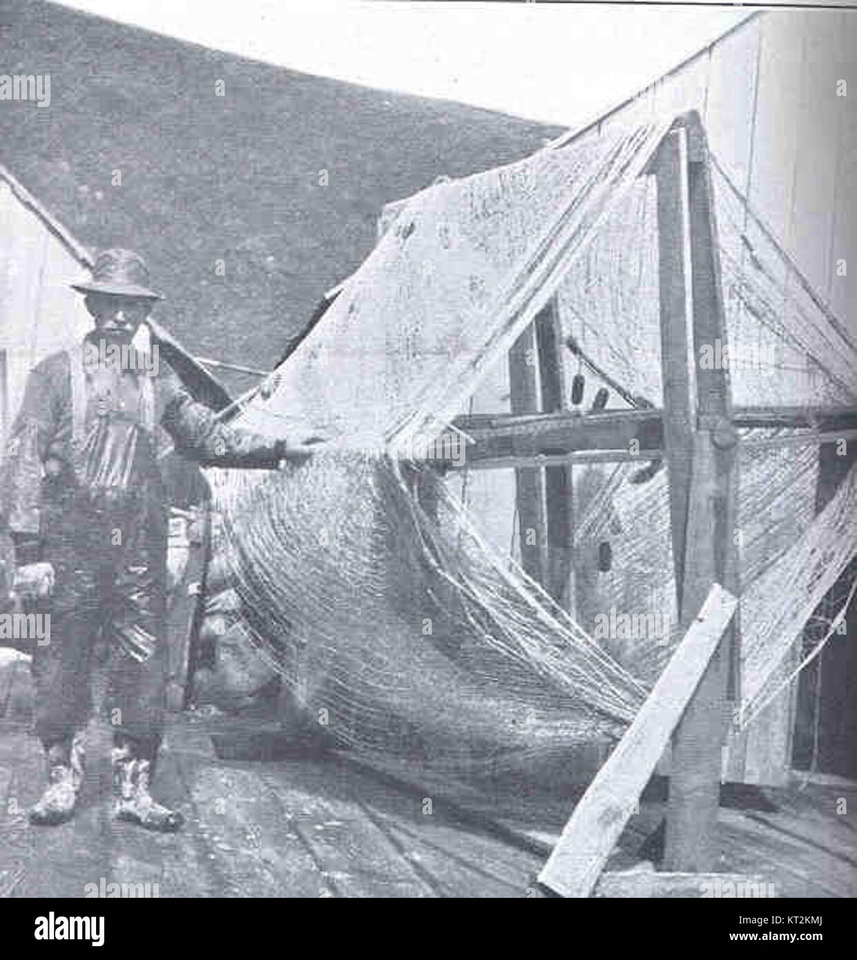 The image shows a reel of cod gill nets used in fishing, a traditional ...
