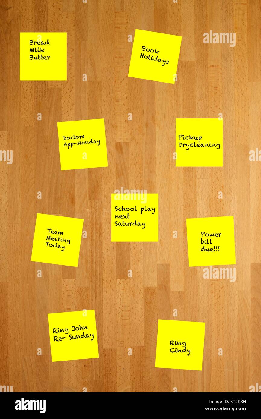 Post it notes stuck to a wooden wall Stock Photo - Alamy