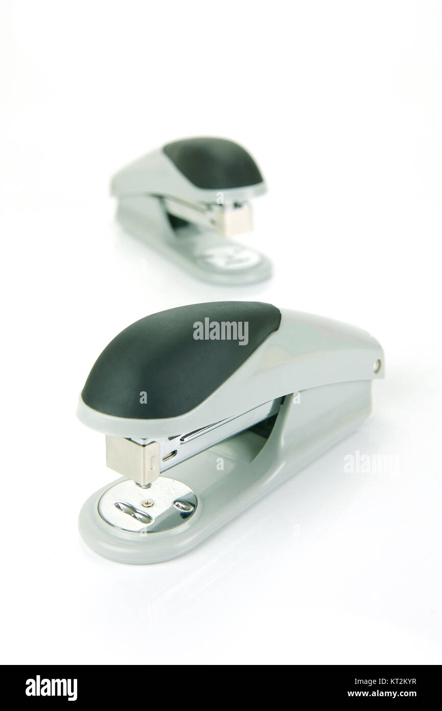 Staplers isolated against a white background Stock Photo - Alamy